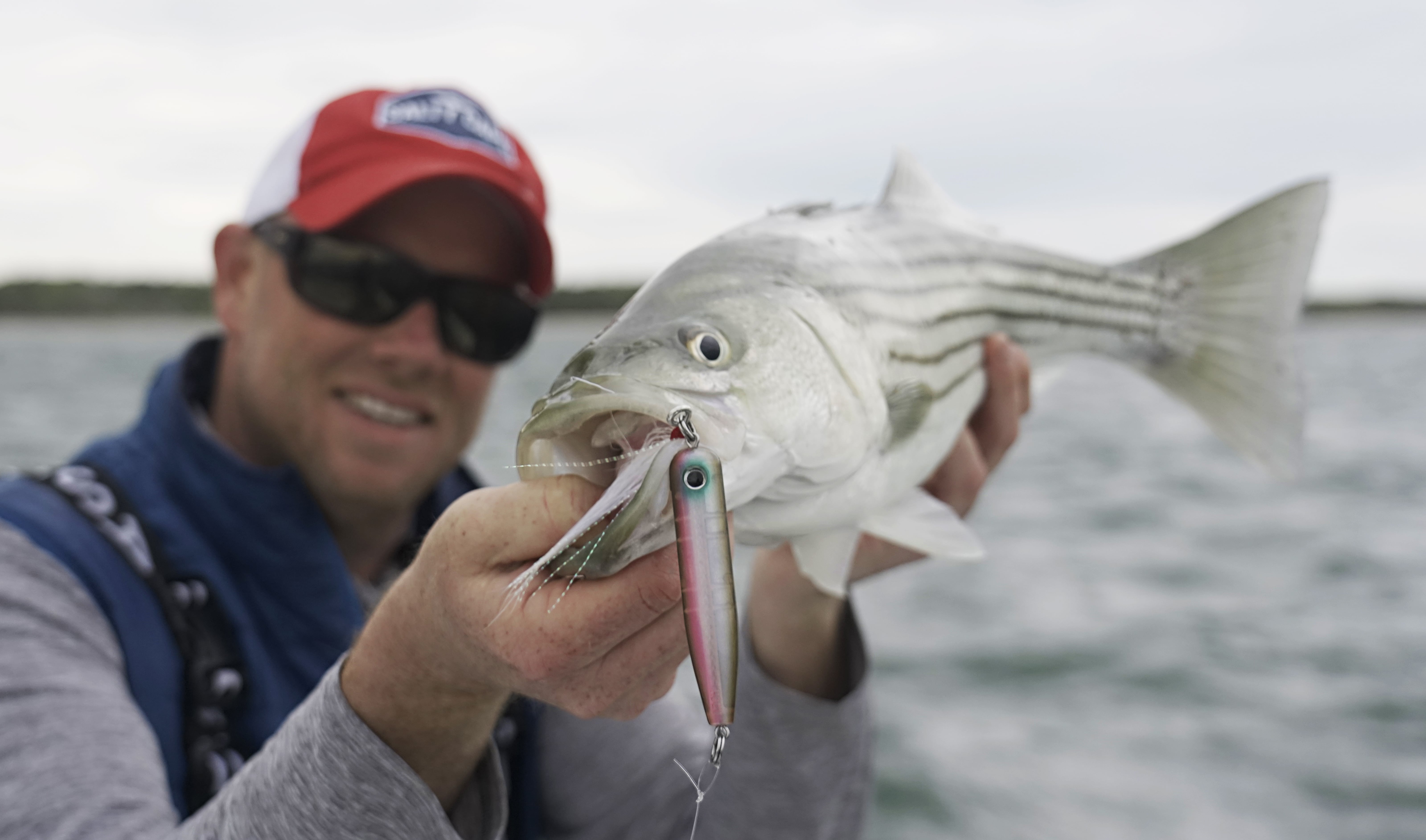 Fishing a Rip with Topwater Squid Plugs for Striped Bass